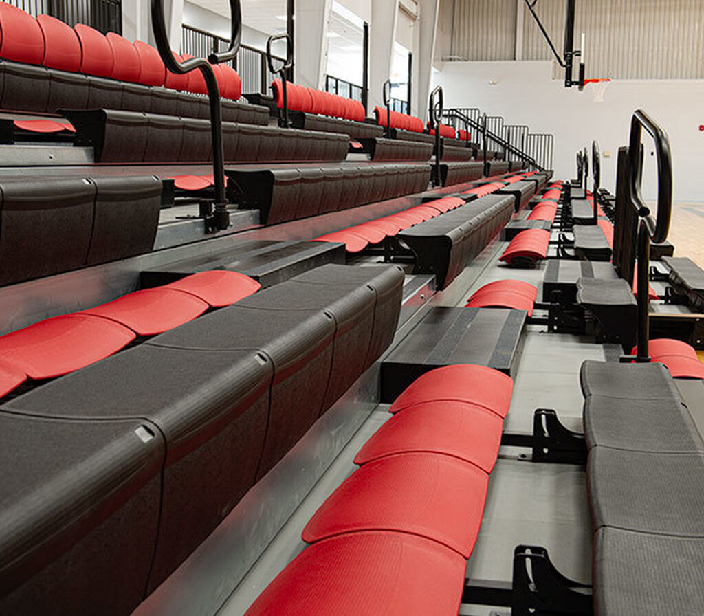 Chase County High School gym with VersaTract telescoping stands with…