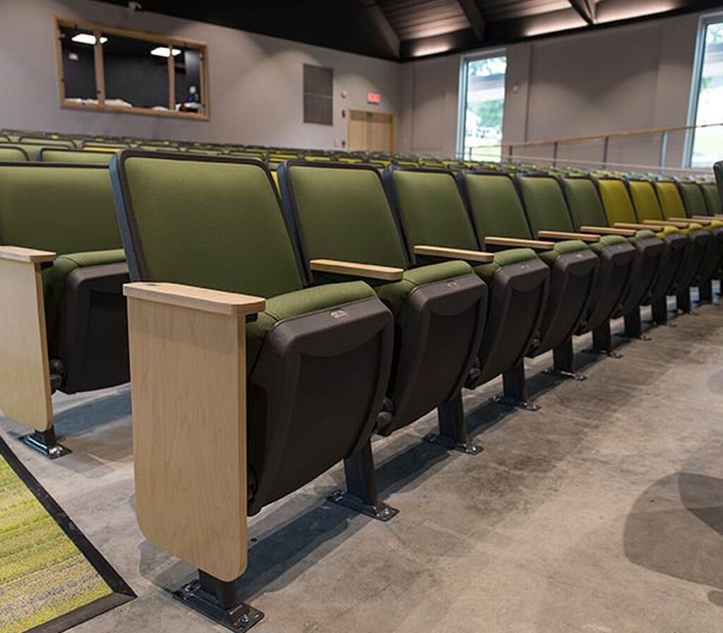 Forman School fixed audience seating by Irwin Seating with model…
